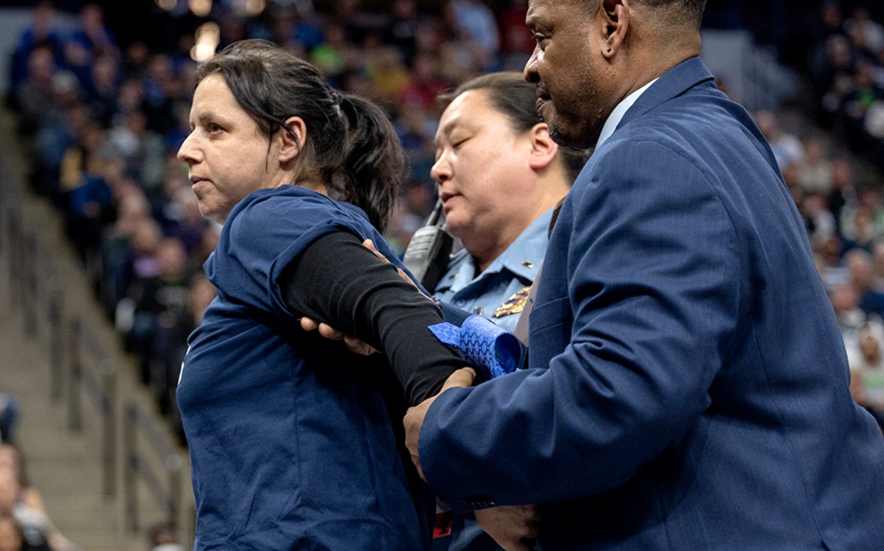 PHOTO Glue Girl Getting Led Off the Floor With Hands Behind Her Back In ...