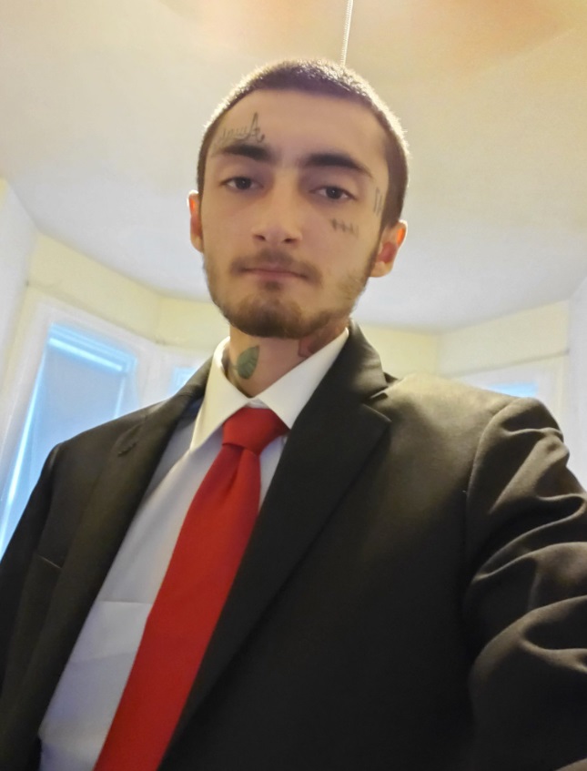 PHOTO Robert Crimo's Red Tie Suit And 47 Are From The Hitman Series