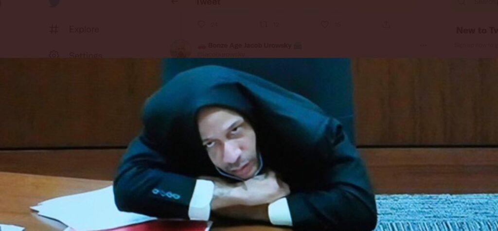 PHOTO Darrell Brooks' Head Buried In His Suit In The Courtroom Meme