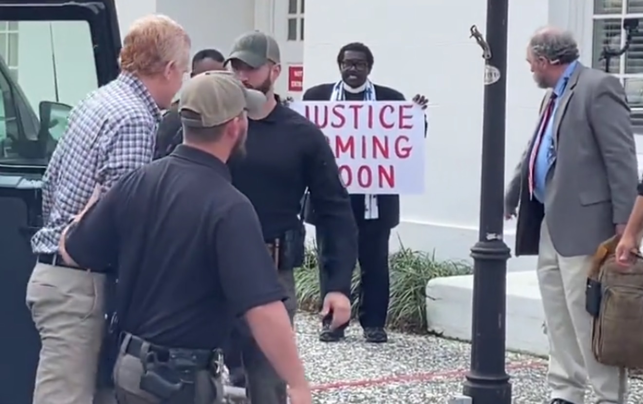 PHOTO Preacher Standing Outside Courthouse Door With Sign That Says ...