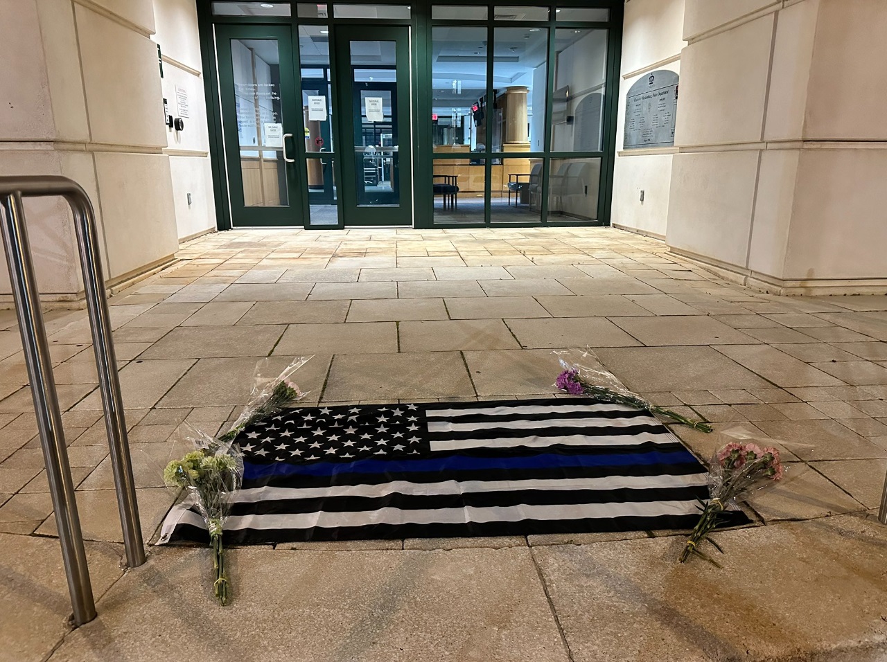 PHOTO Flag With Flowers Lying At The Steps Outside CMPD Headquarters In ...