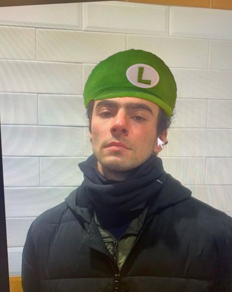 PHOTO Luigi Mangione Wearing Green Luigi Hat From Mario Cart Meme