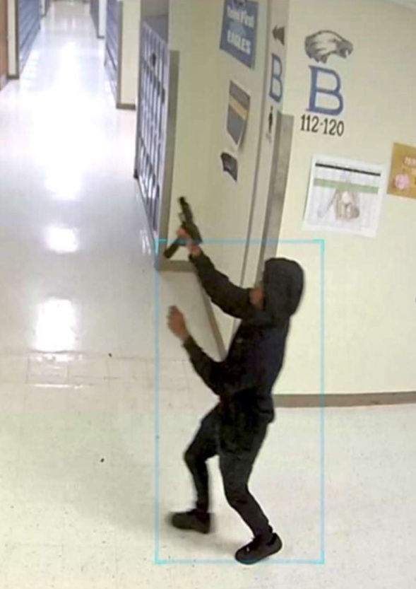 PHOTO Tracy Haynes Caught On School Hallway Security Camera Holding Loaded Gun