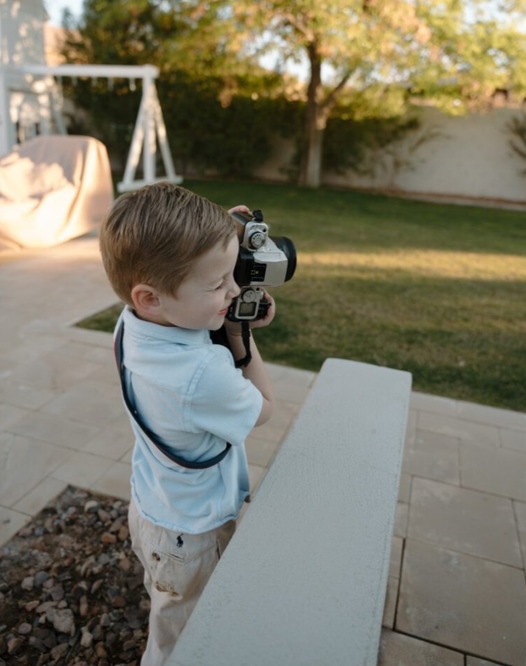 PHOTO Trigg Kiser In His Backyard Taking Pictures With His Camera