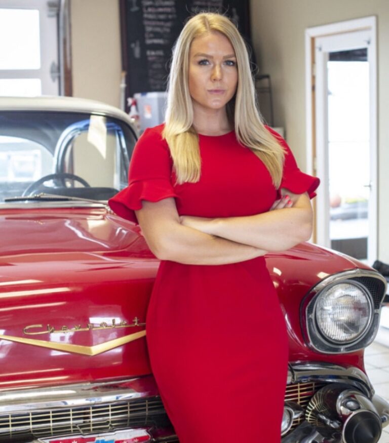 PHOTO Karoline Leavitt Wearing A Red Dress In Front Of An Antique Red ...