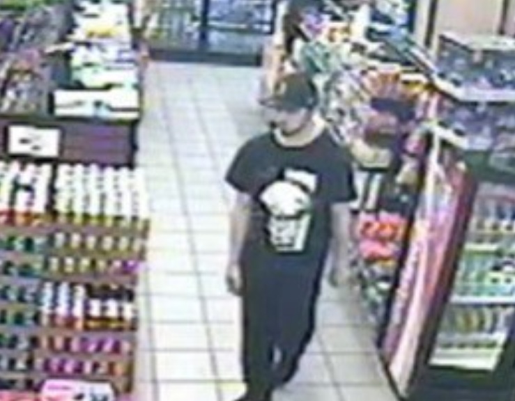 PHOTO Of Austin Robert Drummond Pointing Gun At Clerk To Rob Store