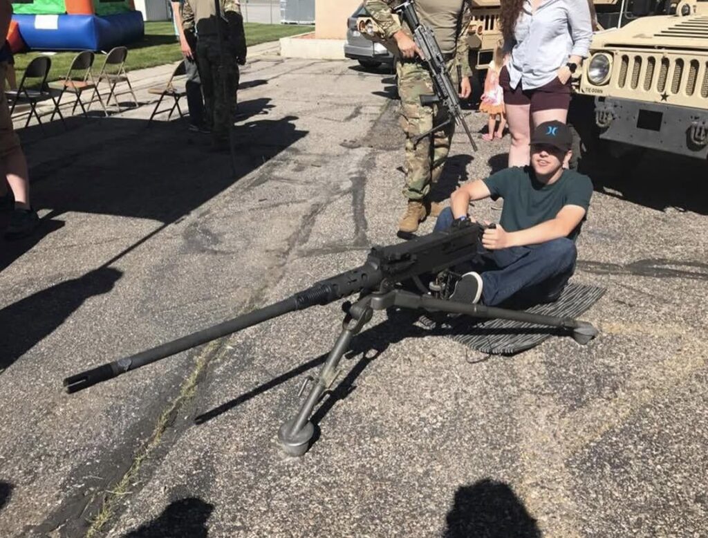 PHOTO Tyler Robinson Holding Huge Gun