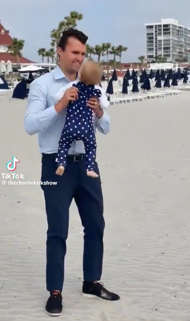 PHOTO Charlie Kirk On The Beach With His Child