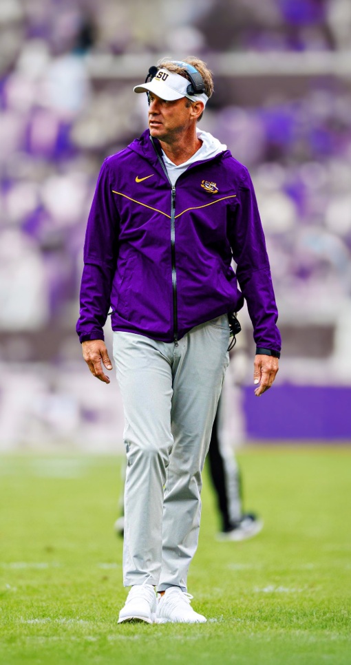 PHOTO Lane Kiffin Walking Tiger Stadium Field In LSU Gear